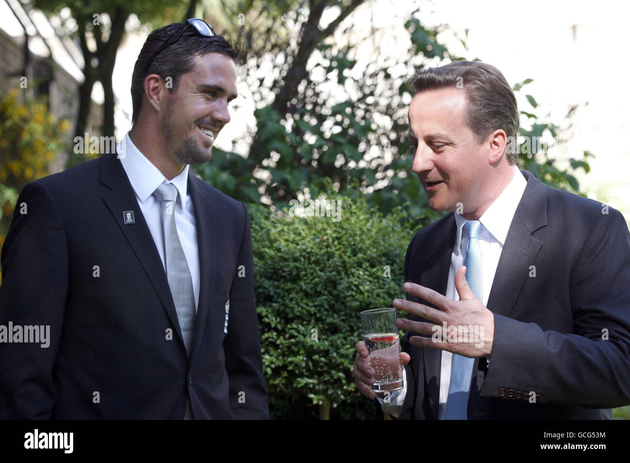 Prime Minister David Cameron talks to Kevin Pietersen (left) during a ...