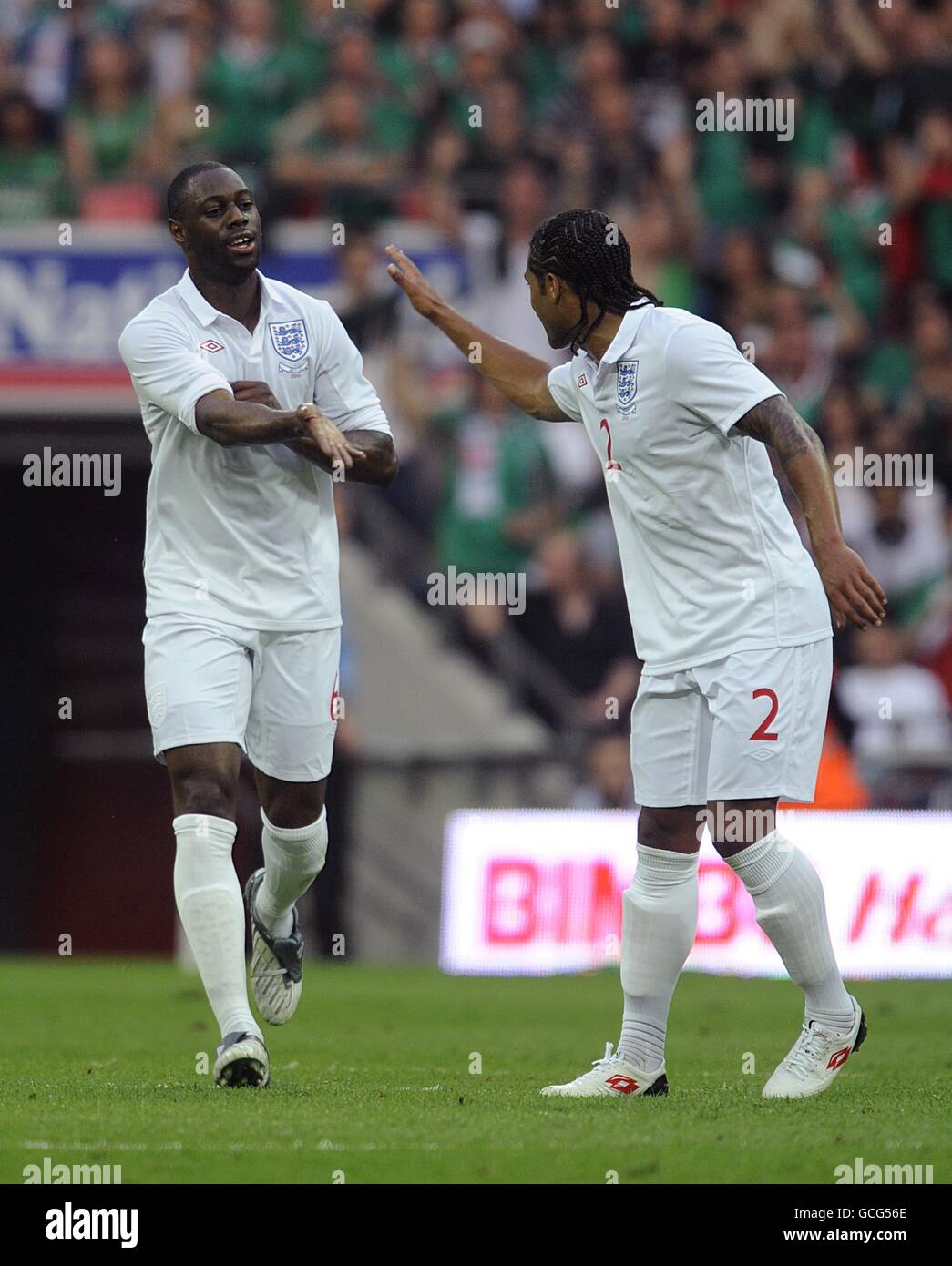 England's Ledley King (left) celebrates with team mate Glen Johnson ...