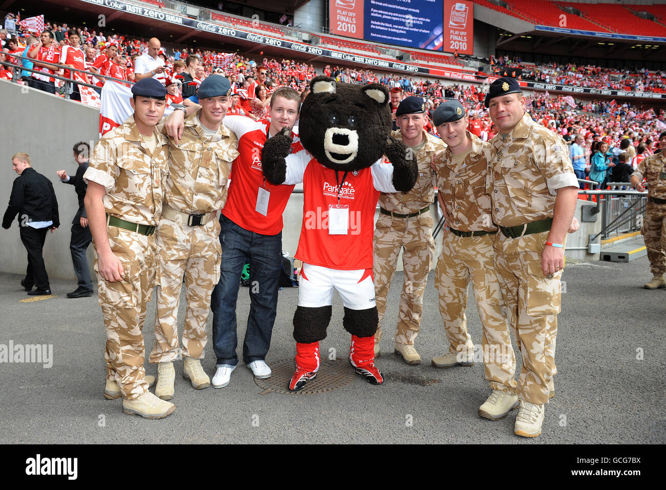 Members of the armed forces pose for a photograph with Rotherham United ...