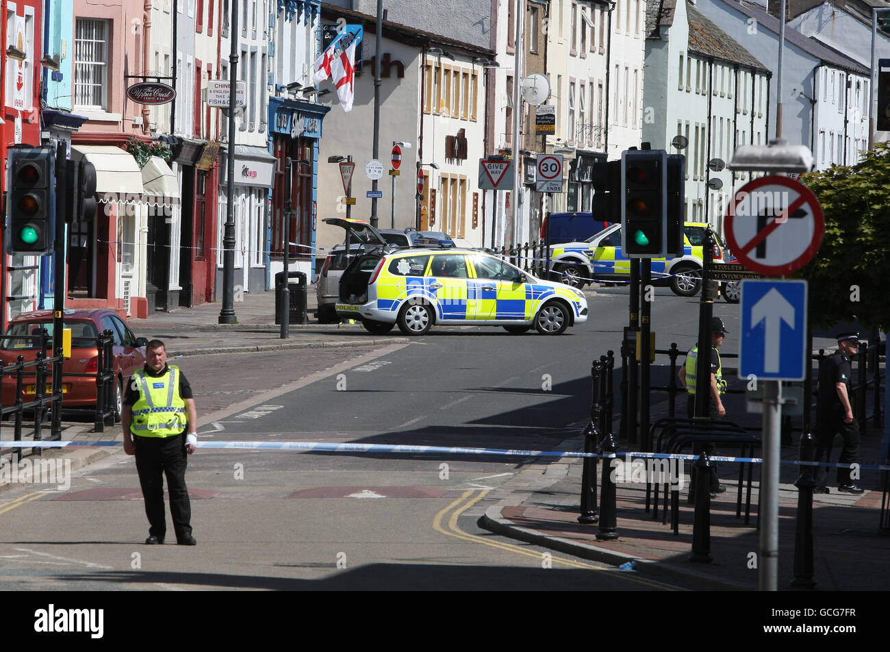 Police officers attend the scene on Duke Street in Whitehaven where a ...