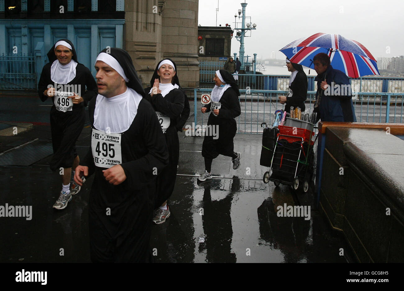 Umbrel men women dressed as nuns run tower bridge in london hi-res ...