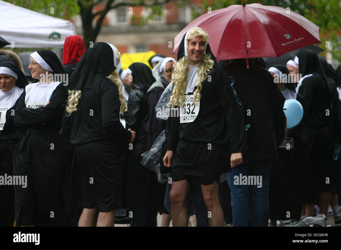 Men and women dressed as nuns prepare to take part in a four mile run ...