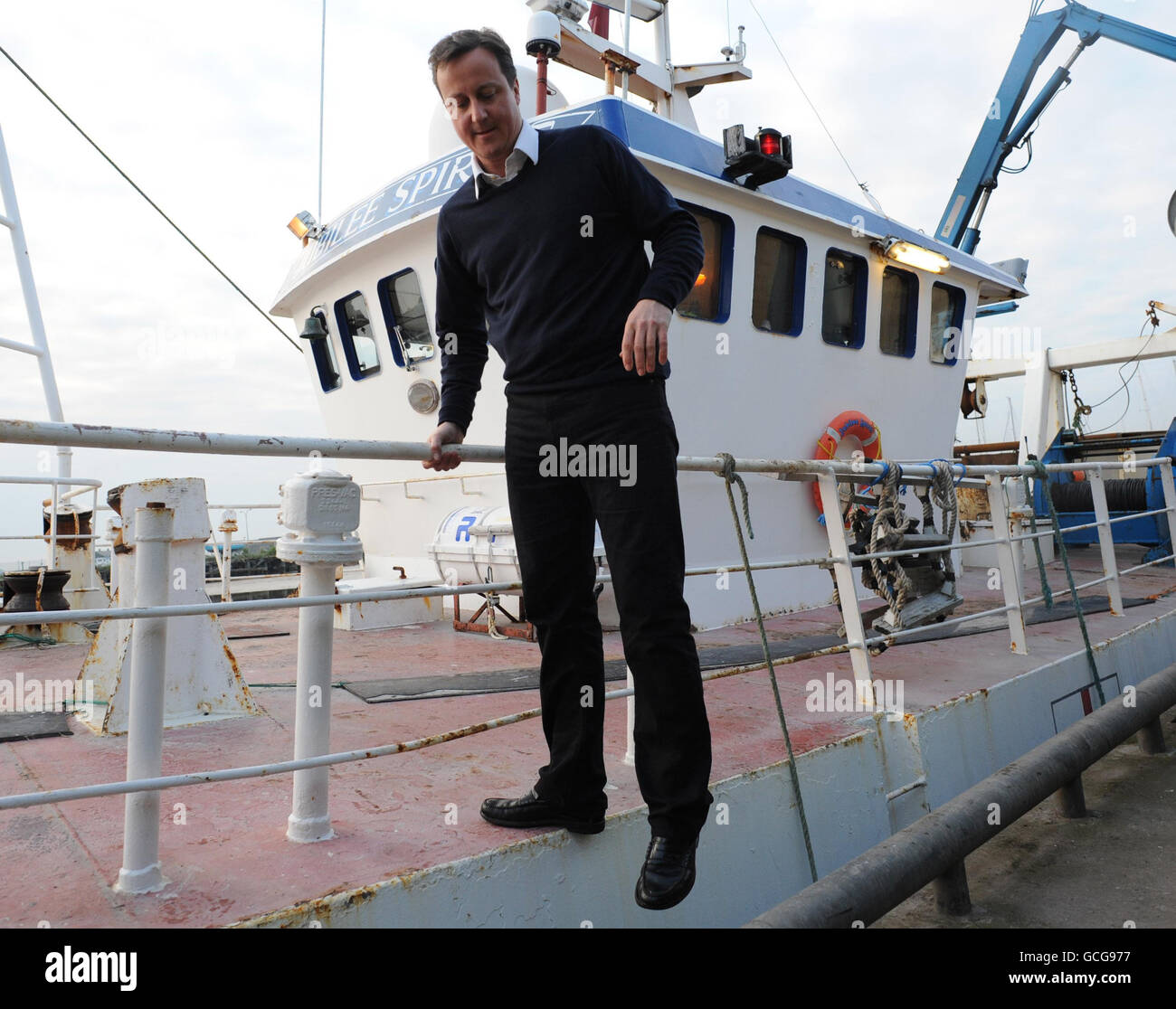 Conservative Party leader David Cameron climbs off a fishing trawler ...