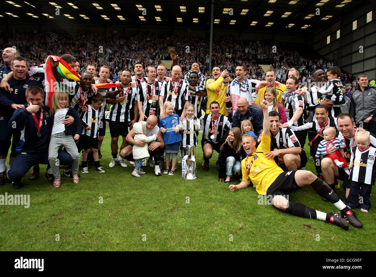 Notts County players and staff celebrate with the Coca-Cola Football ...