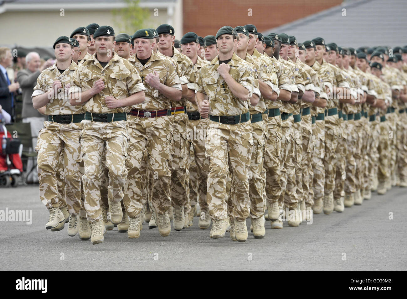 Soldiers of 4 Rifles march 'double time' as they parade around the ...