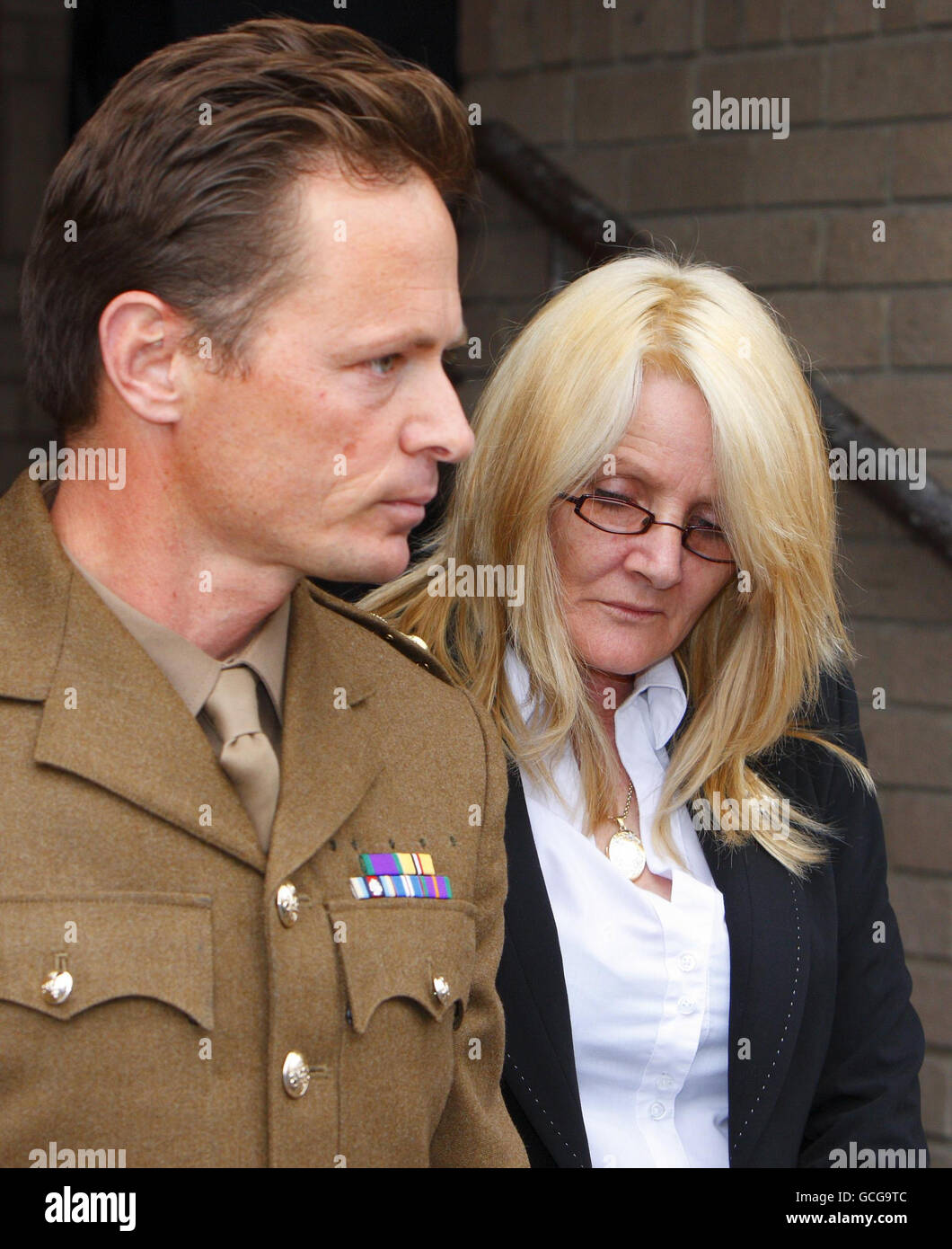 Jacqui Janes listens as Lt Col Roly Walker of the Grenadier Guards ...