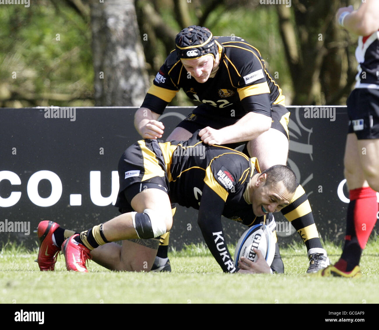 Currie's Willie Moala is congratulated on scoring their first try of ...