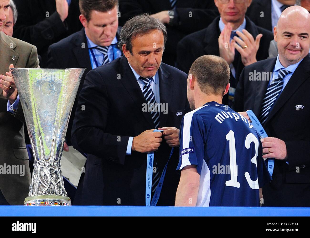 Fulham's Danny Murphy (right centre) is consoled by UEFA President ...
