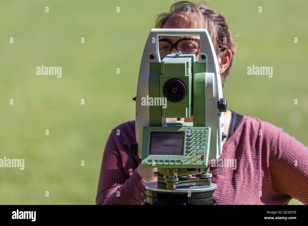 Female surveyor conducting a survey with the Leica Total Station Stock ...
