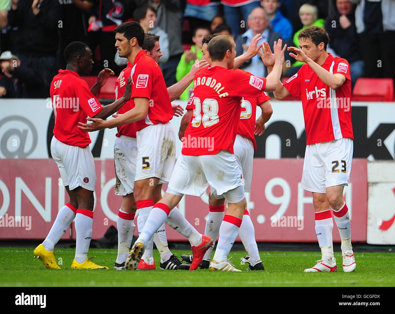 Charlton Athletic player's celebrate after Swindon Town's Simon Ferry ...