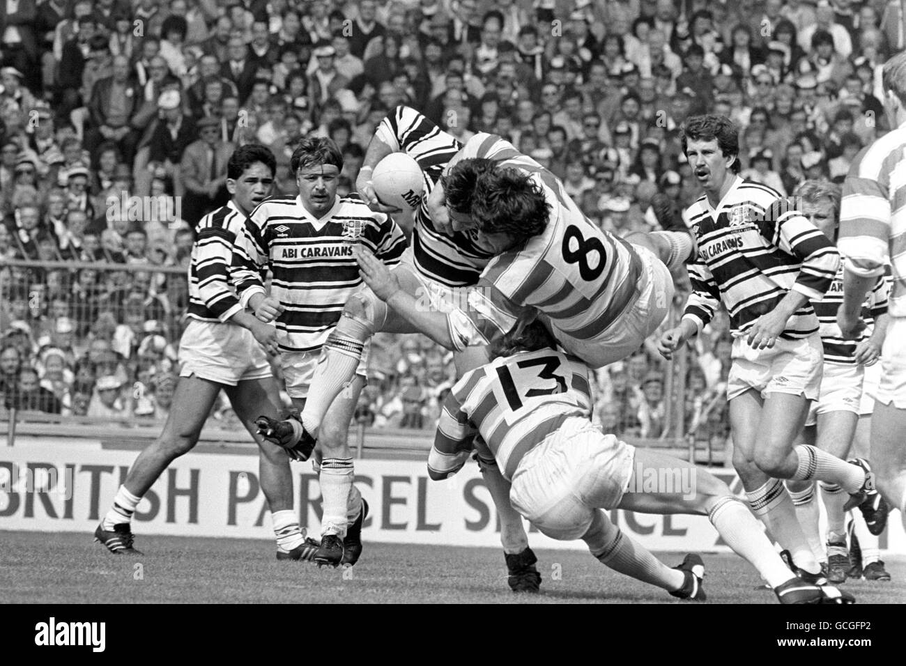 Hull's John Muggleton caught in a flying tackle from Wigan's Neil ...