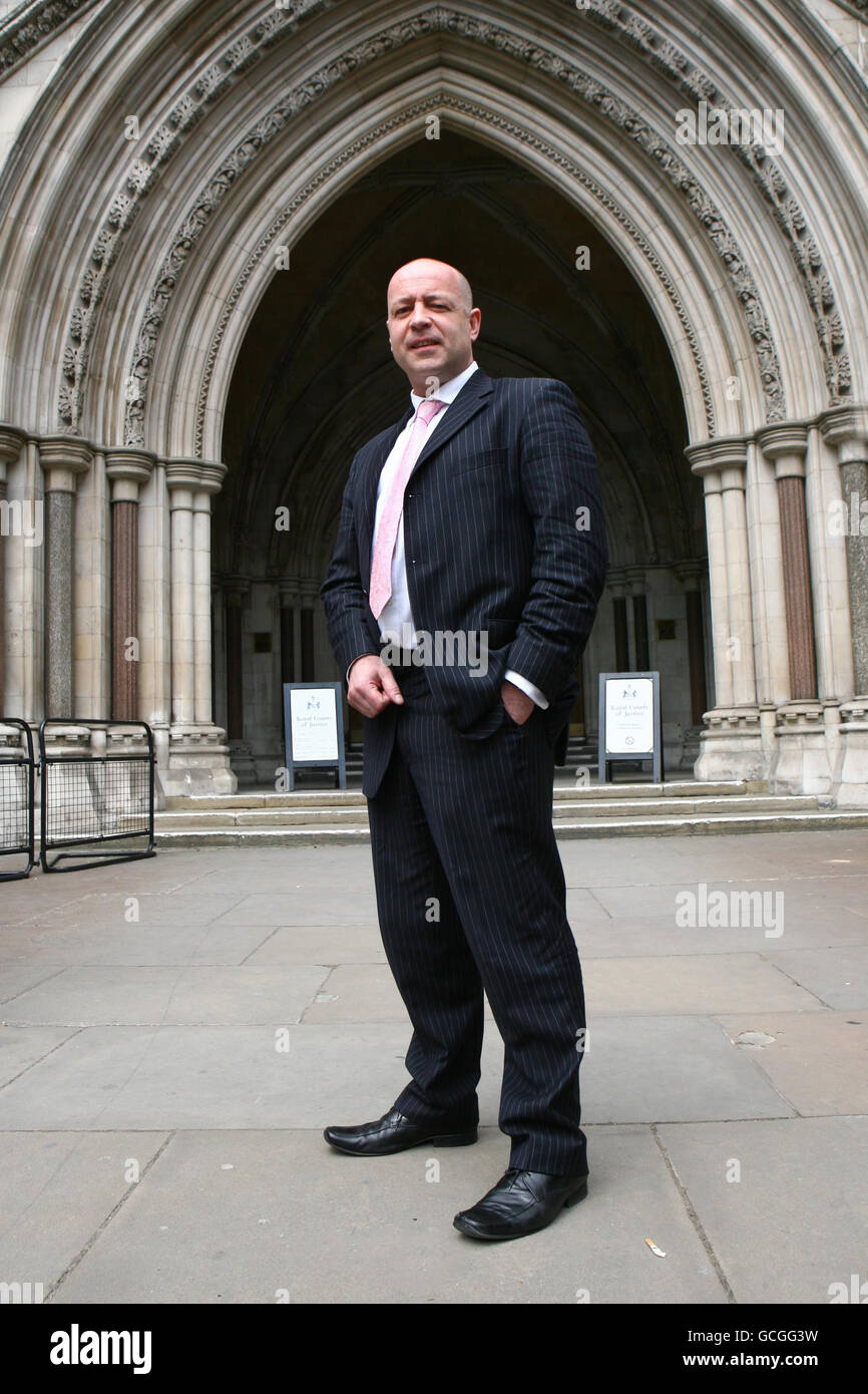 Neil Herron, from Sunderland, is photographed outside the Royal Courts ...