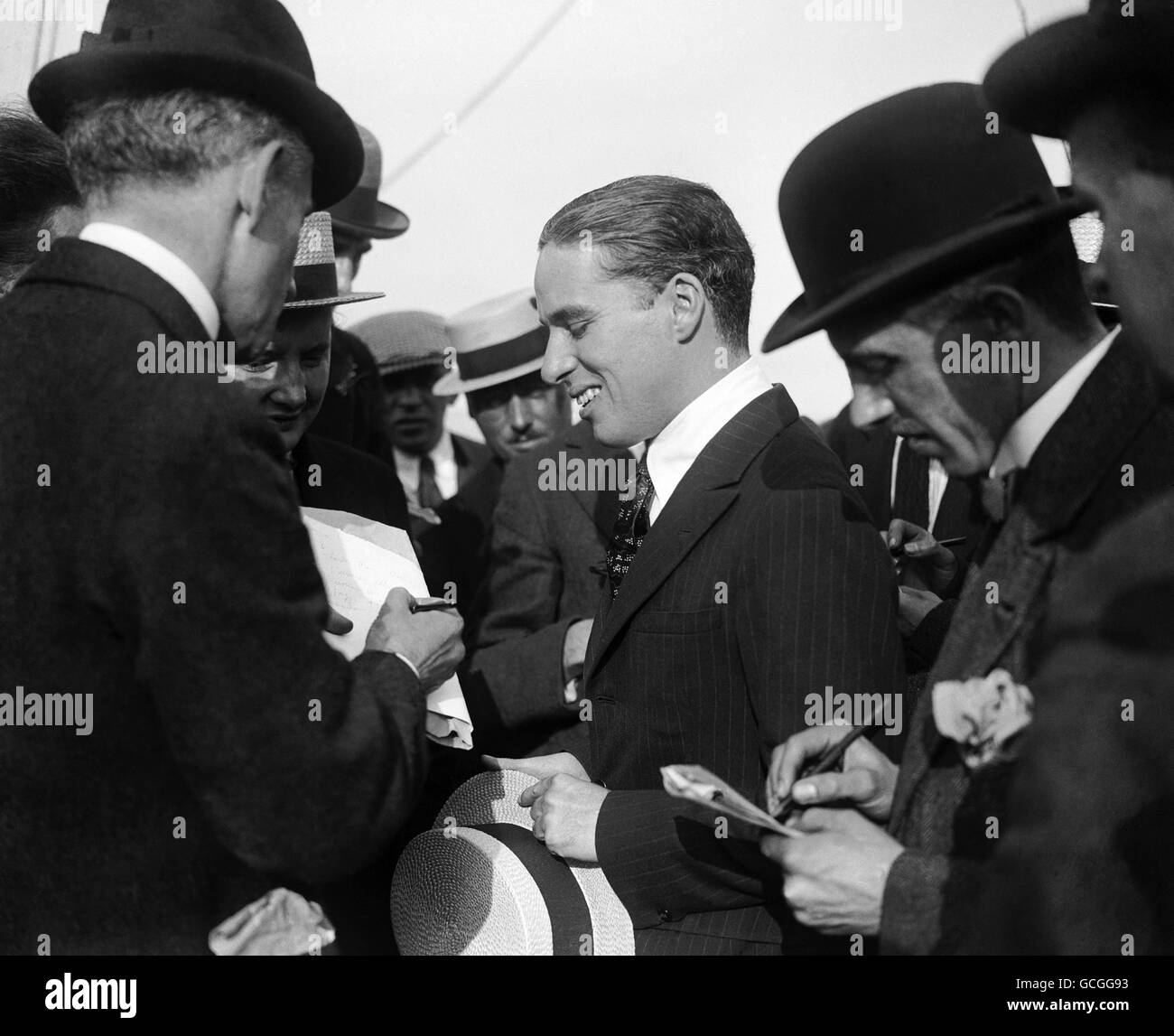 Charlie Chaplin. A smiling snapshot of Charlie Chaplin, being ...