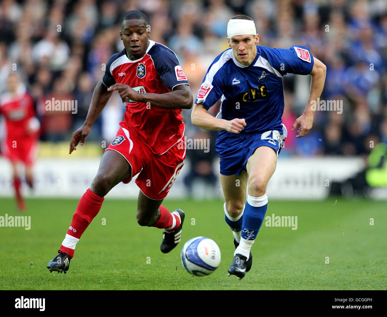 Huddersfield Town's Neal Trotman (left) and Millwall's Steve Morison ...
