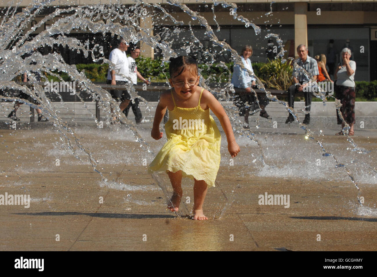 A child plays in the fountains in Nottingham's Old Market Sqaure, as ...