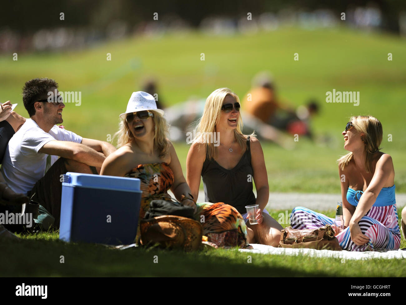 Spectators enjoy the hot weather during the third round of the BMW PGA ...