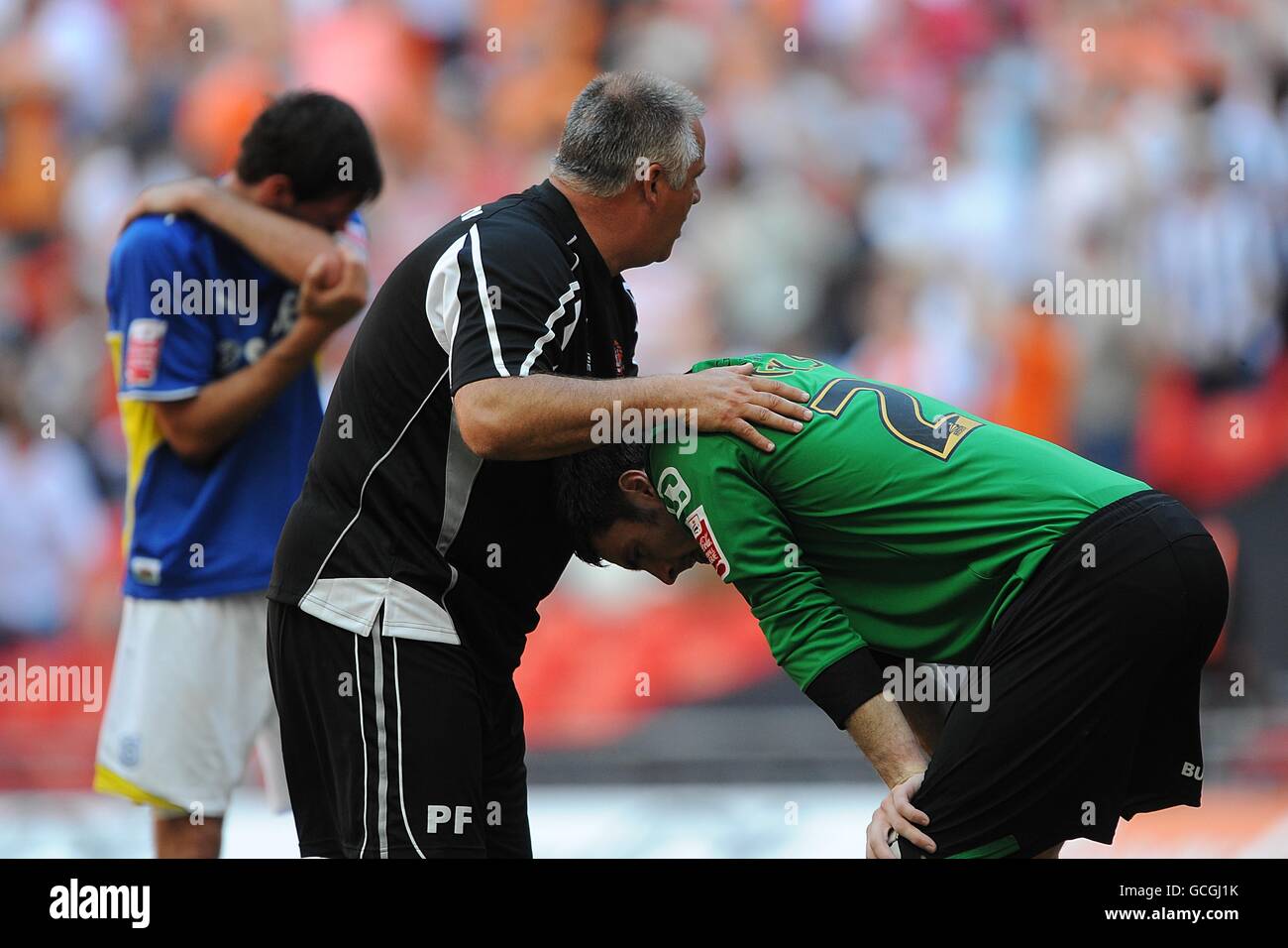 Blackpool goalkeeper Matthew Gilks (right) is congratulated after the ...