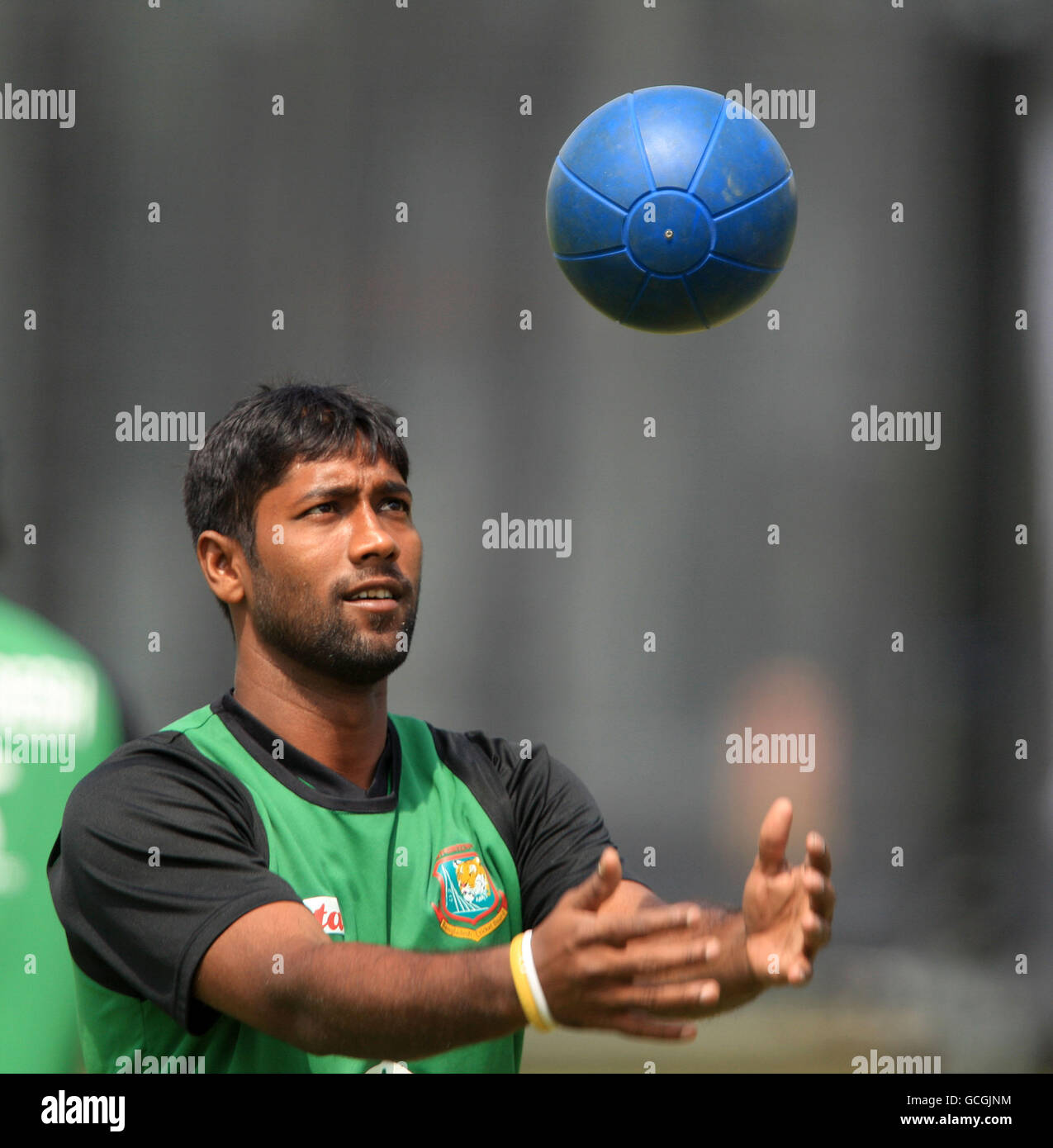 Bangladesh's Robiul Islam plays with a ball before nets Stock Photo - Alamy
