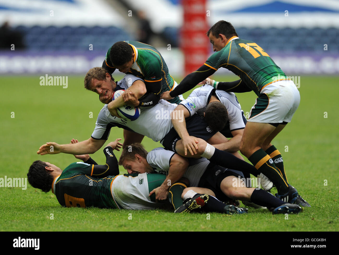 Scotland's Mark Robertson is brought down by South Africa's Ryno ...