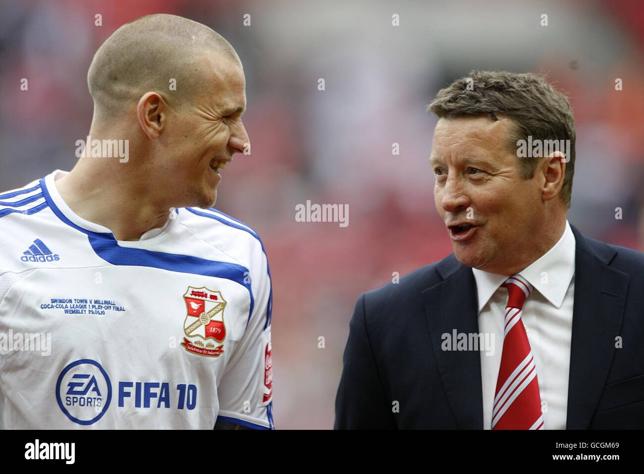 Swindon Town manager Danny Wilson (right) and Jon-Paul McGovern (left ...