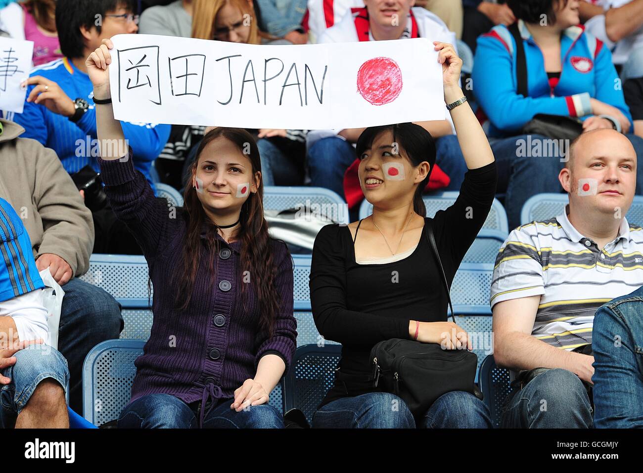Japan fans show their support in the stands hi-res stock photography ...