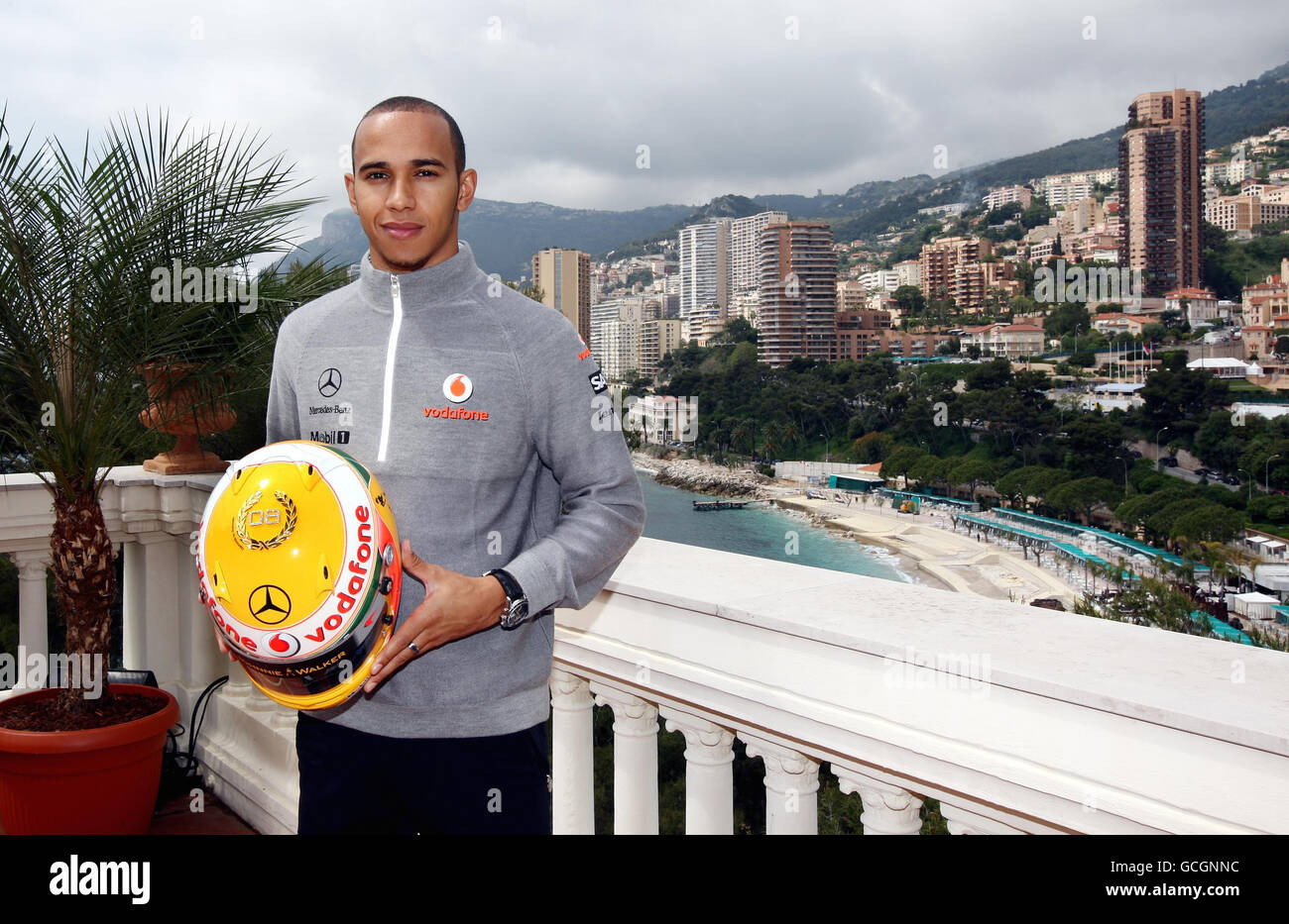 McLaren drivers Lewis Hamilton poses with his Monaco race diamond ...
