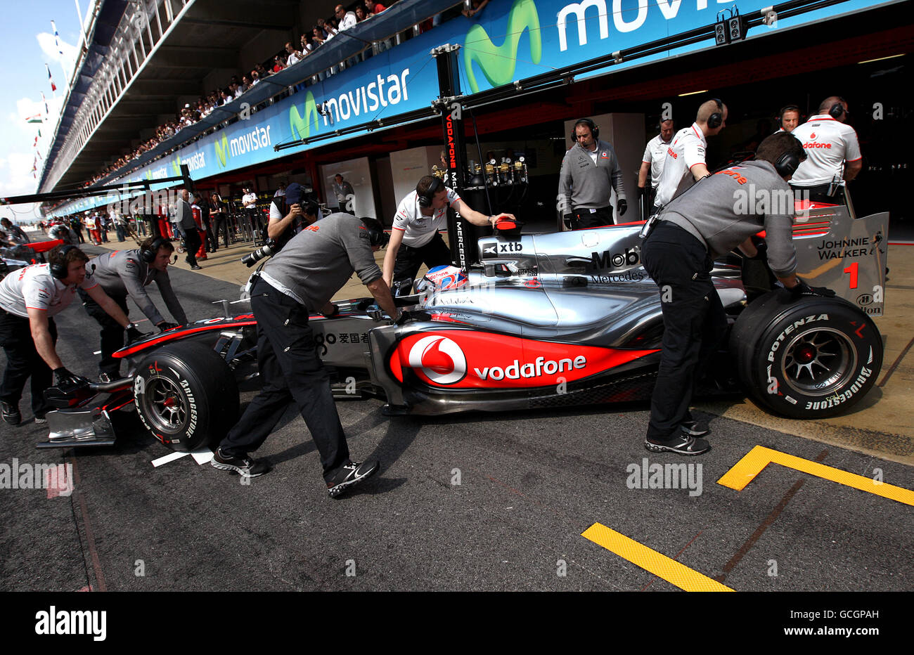 Mechanics push jenson buttons mclaren mercades back into the garage hi ...