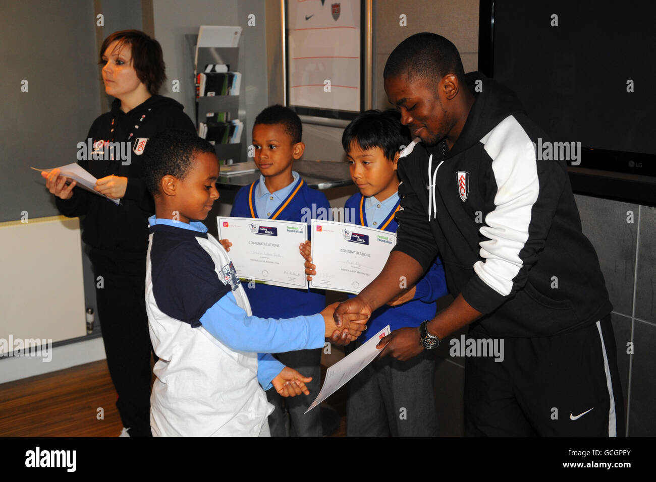 Young fans receive Premier League reading certificates at the Fulham ...
