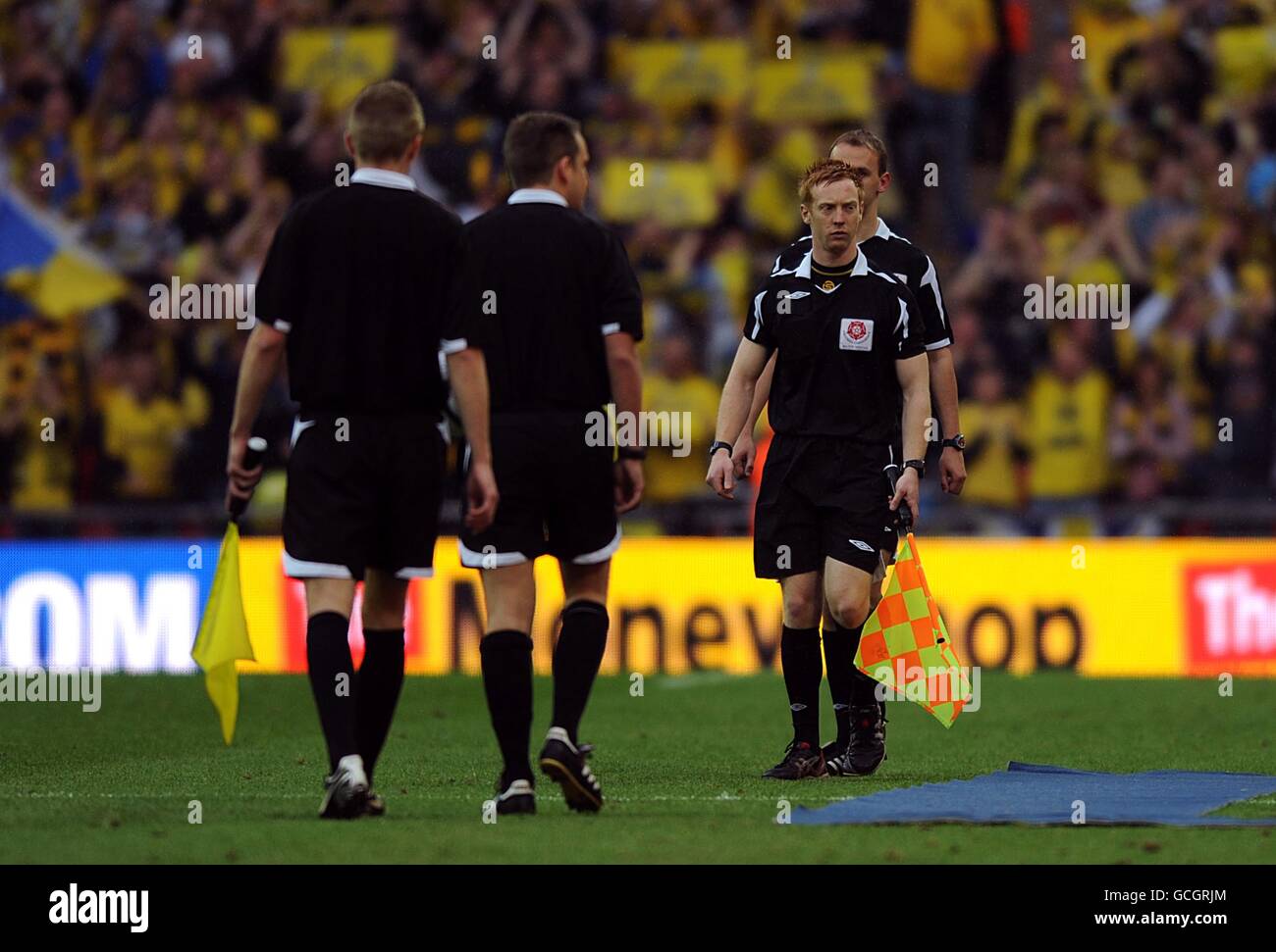 Assistant referee Carl Fitch before the start of the playoff final ...