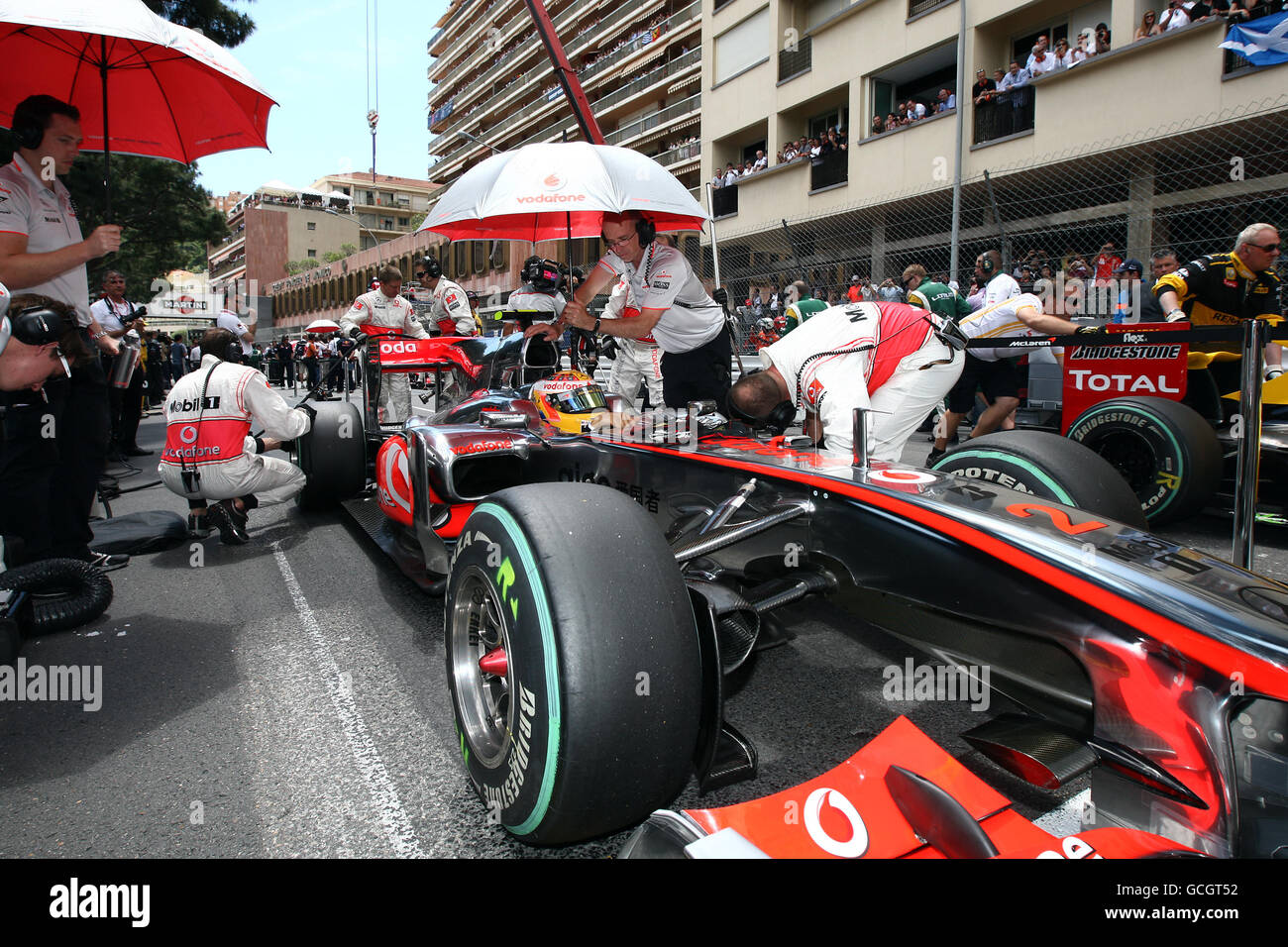 McLaren Mercedes driver Lewis Hamilton sits in the cockpit of his car ...