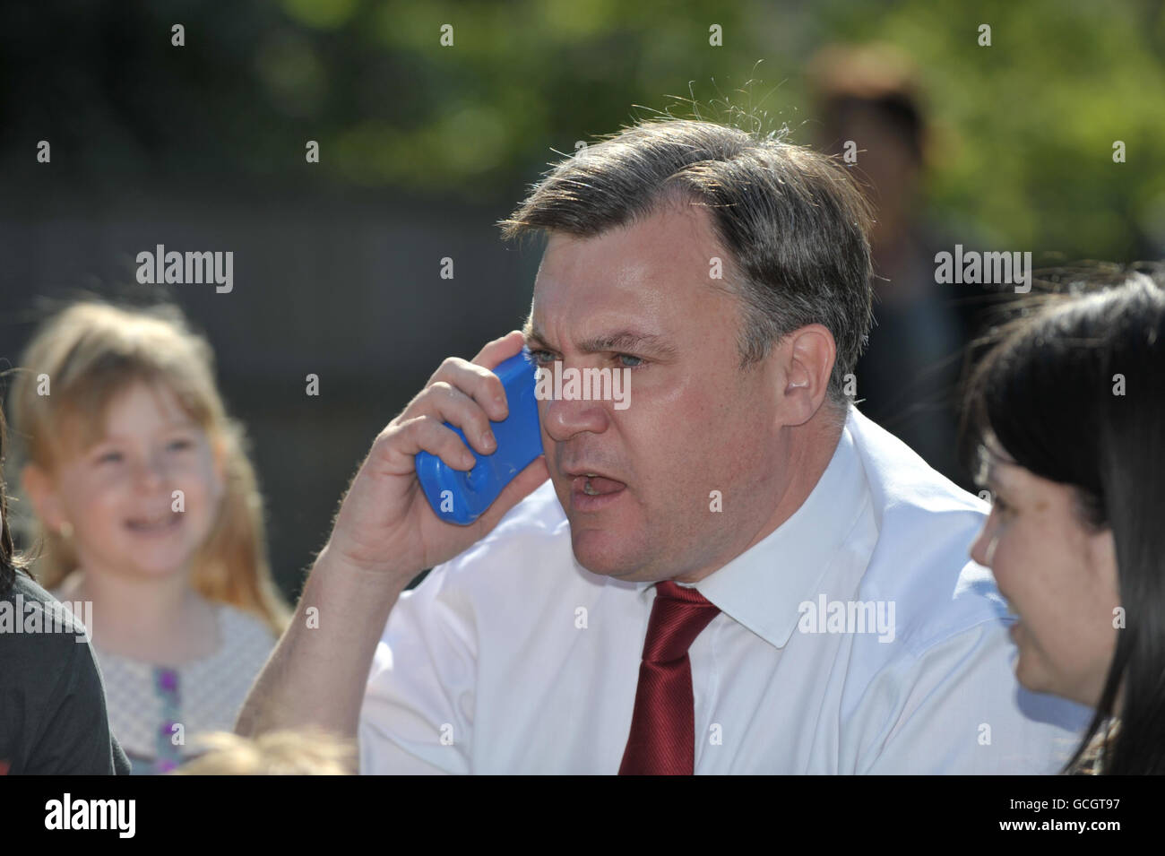 Former children's secretary Ed Balls speaks on a toy phone during a ...