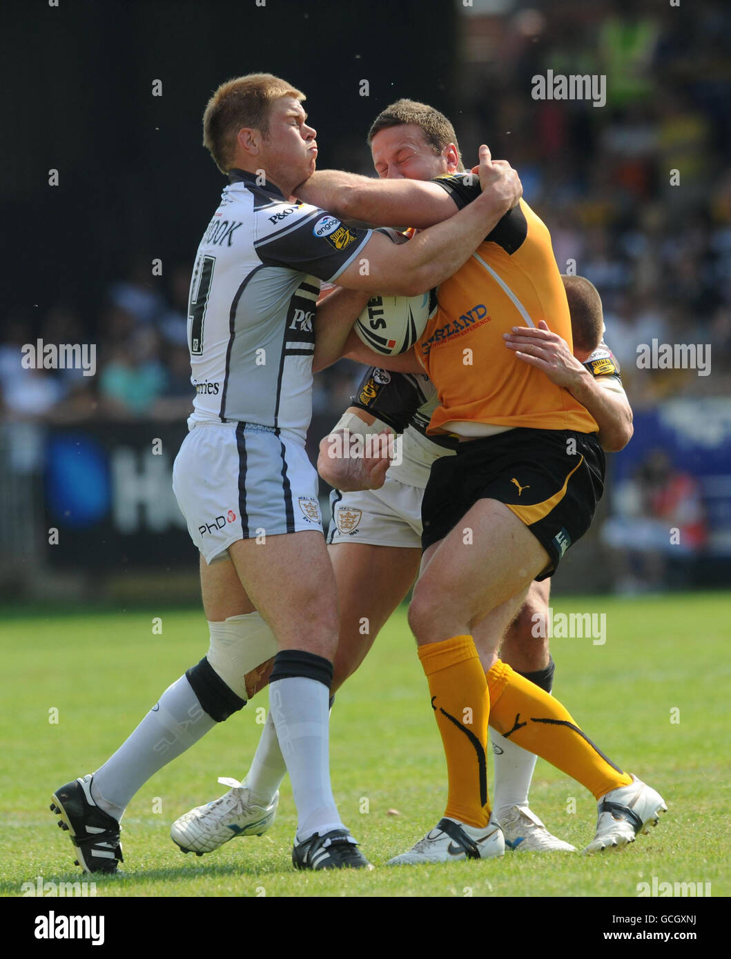Castleford's Steve Snitch is tackled by Hull FC's Danny Washbrook (left ...
