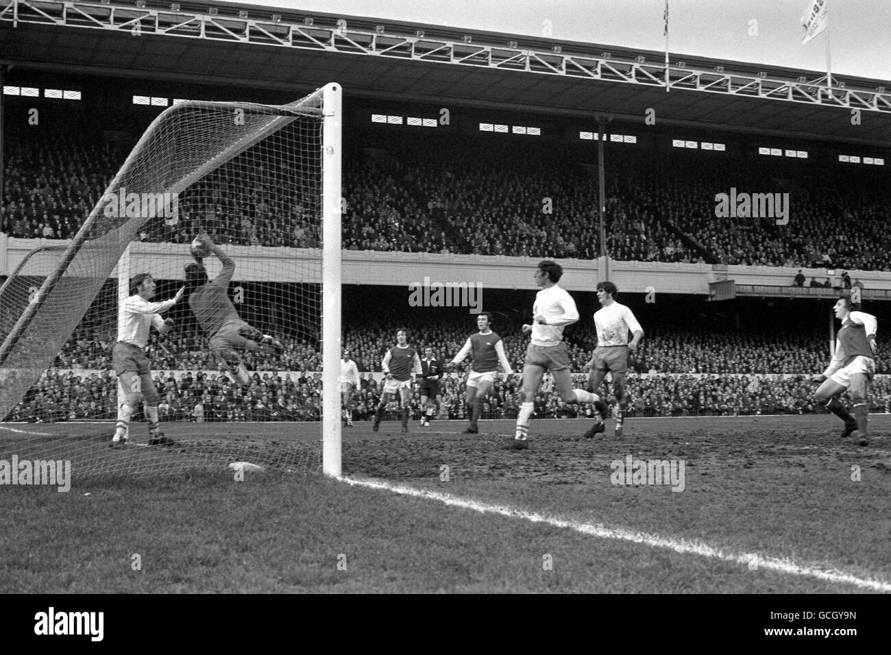 Blackpool goalkeeper Neil Ramsbottom flies across the goalmouth to make ...