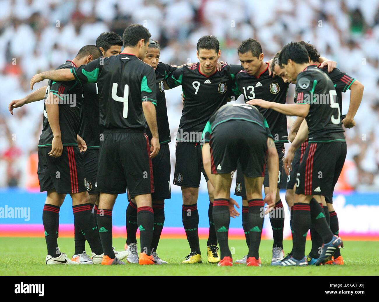 Mexico players enter in to a team huddle prior to kick off Stock Photo ...