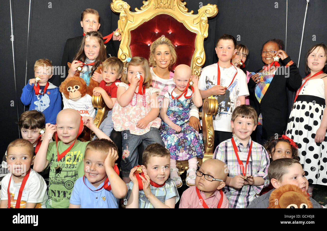 Singer Stacey Solomon at London Zoo with some of the children who were ...