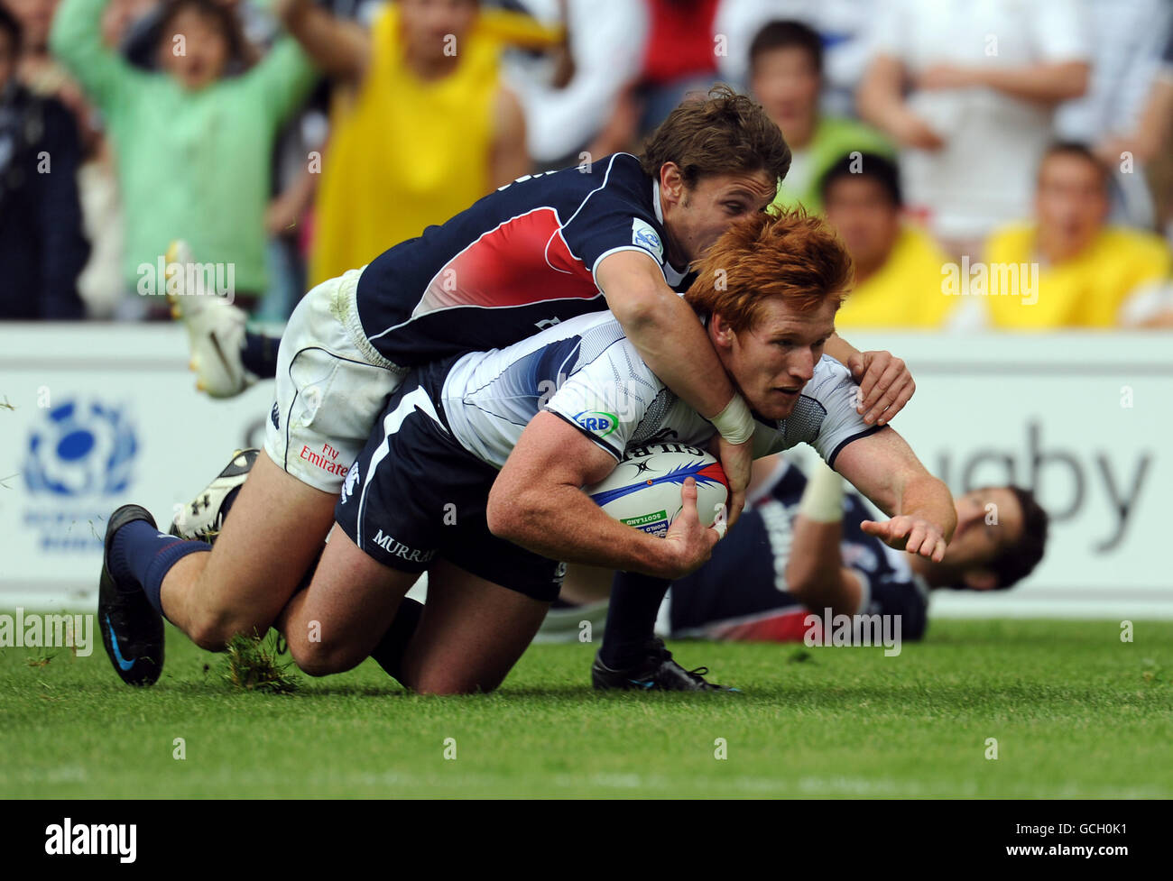 Scotland's Roddy Grant is brought down by USA's Blaine Scully Stock ...