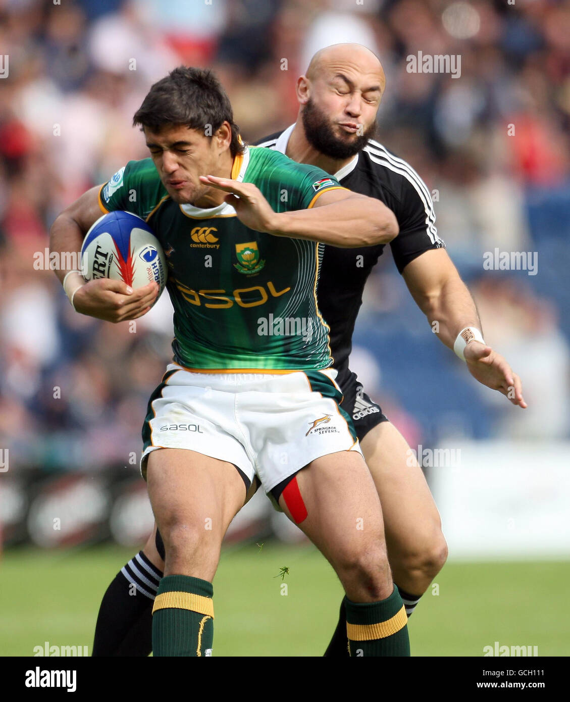 South Africa's Chris Dry gets tackled by New Zealand's D J Forbes ...