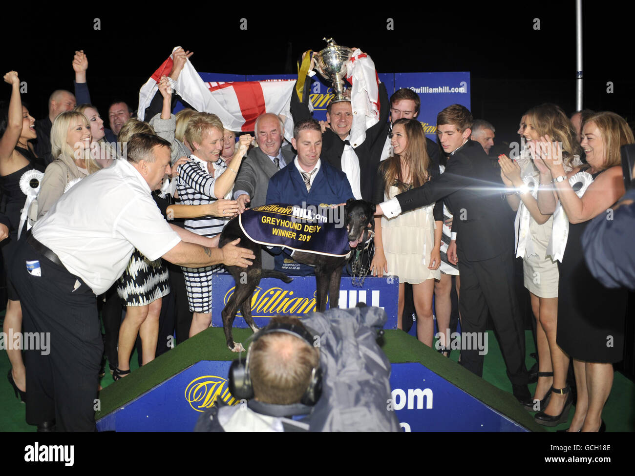 Owner Ray White lifts his third trophy after winning the Williamhill ...