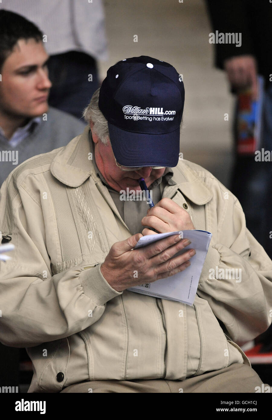 A spectator in the stands during the Wimbledon Greyhound Derby at ...