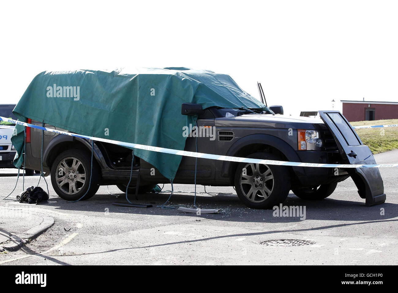 A vehicle is seen under a green cover, on a street in Seascale, Cumbria ...