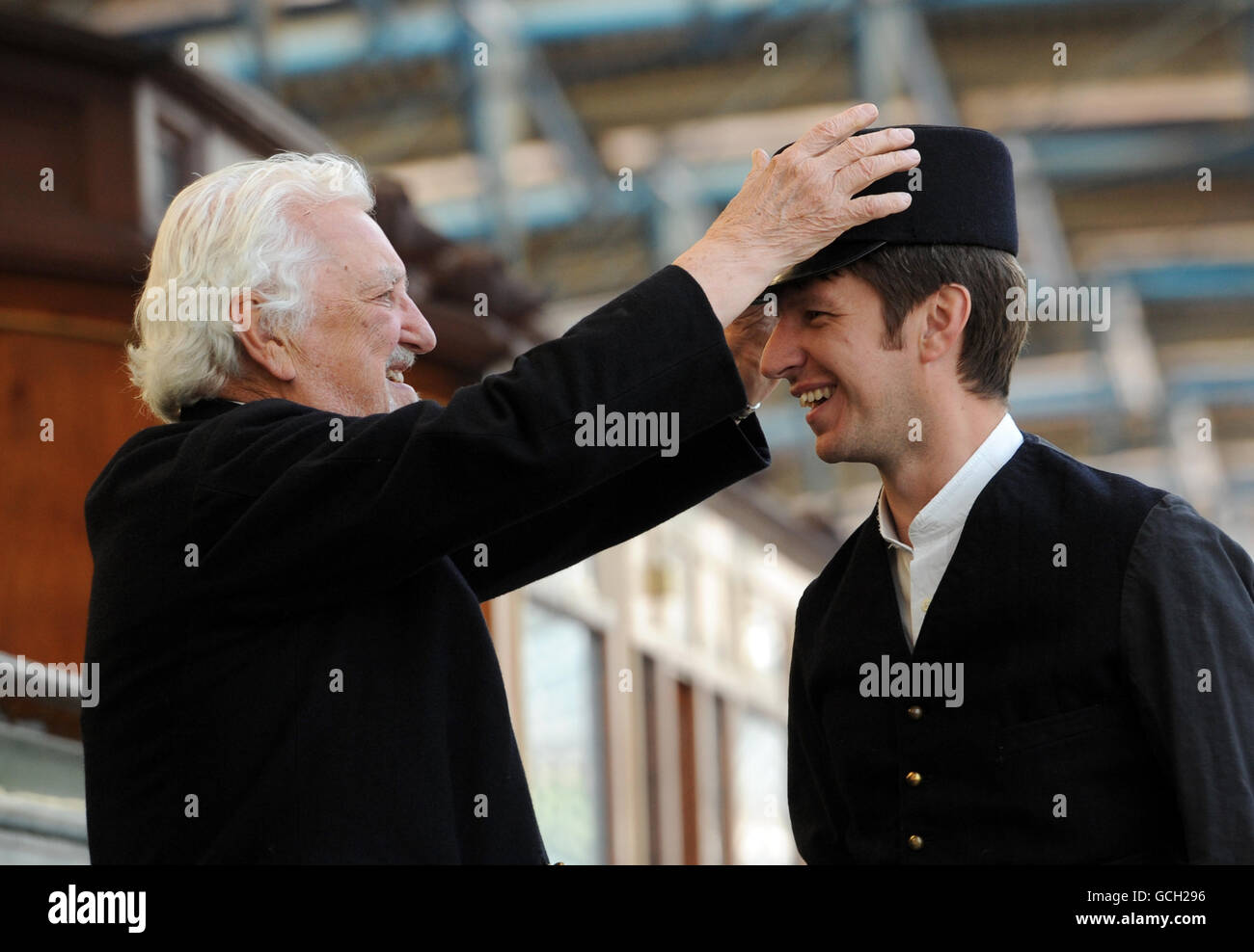 Bernard Cribbins (left) hands over the station master's cap to Marshall ...
