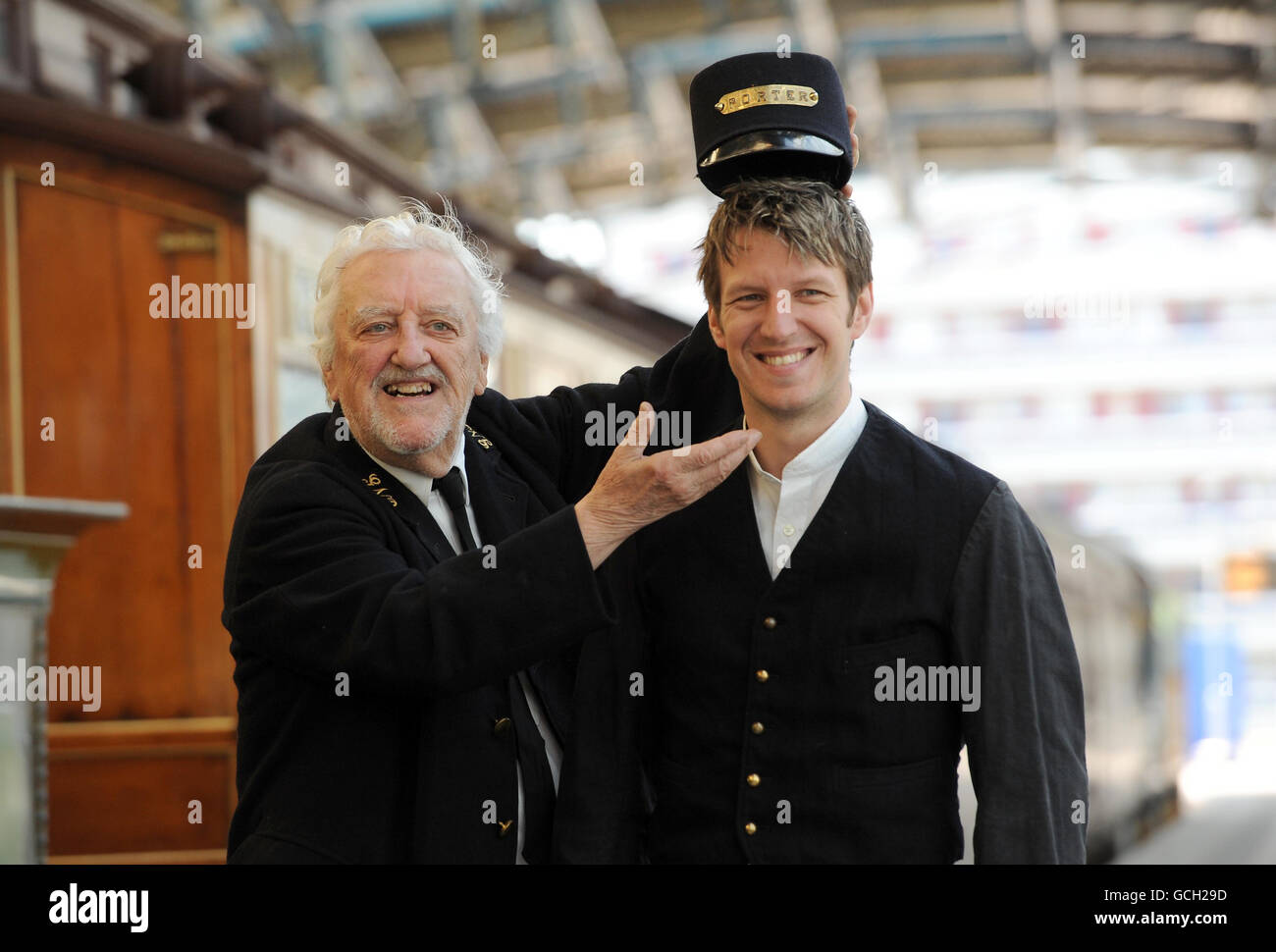 Bernard Cribbins (left) hands over the station master's cap to Marshall ...