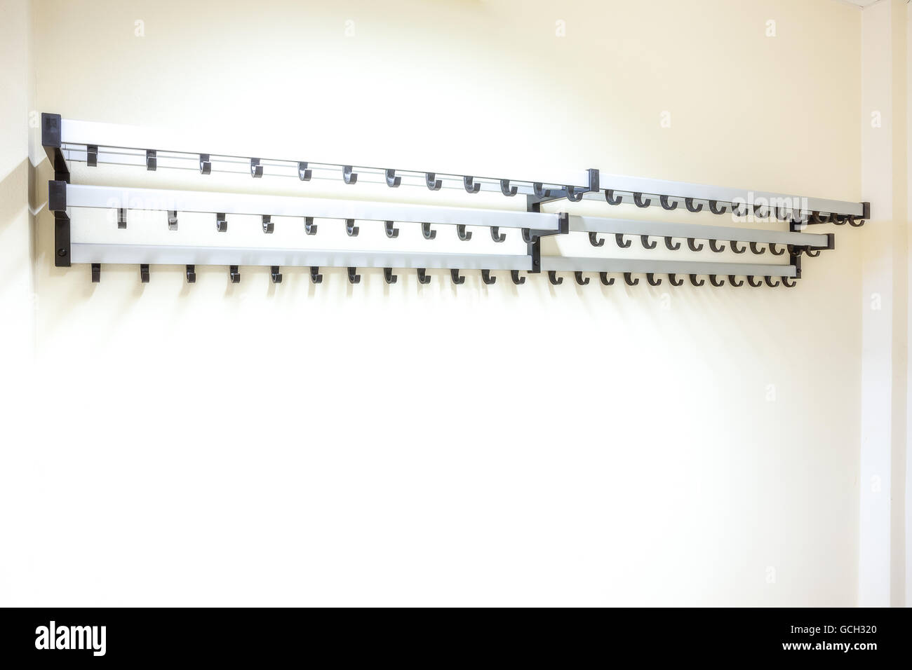 in the hallway of the school hangs a coat rack on the wall Stock Photo ...