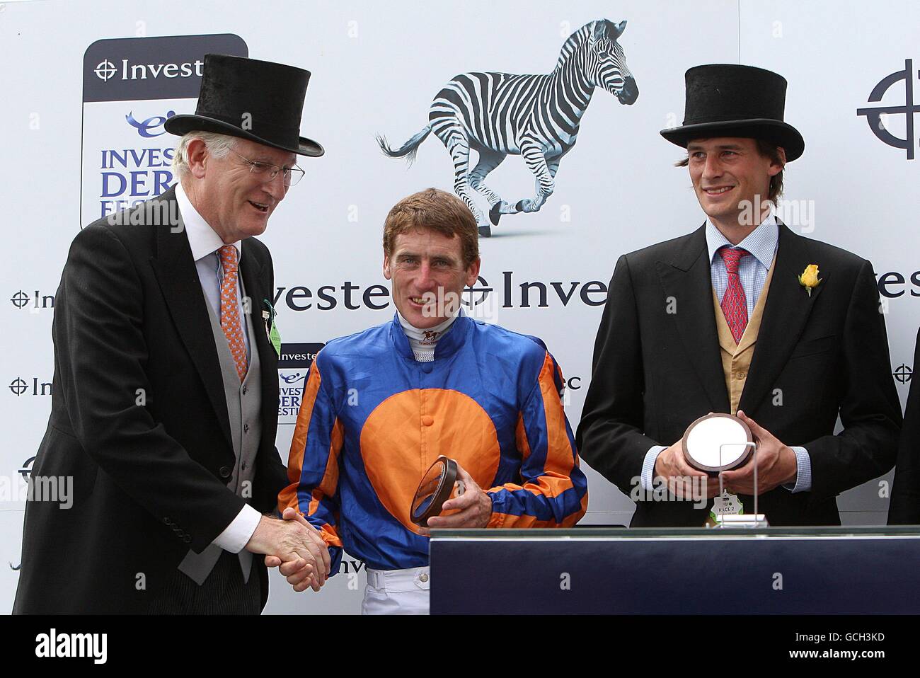 Johnny Murtagh collects his trophy after winning the Investec Woodcote ...