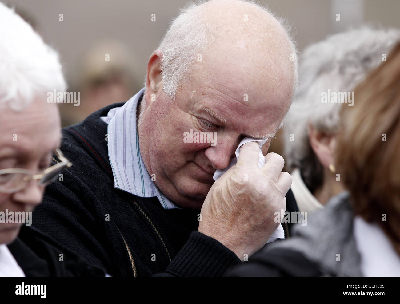 A man wipes his eye during a civic memorial service at Frizington, to ...