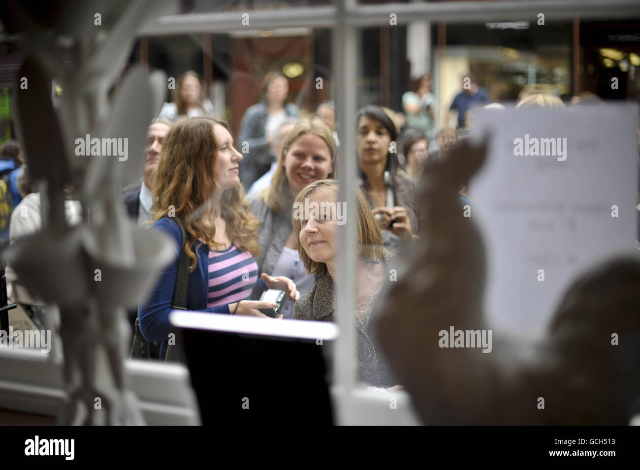 A woman tries to peep inside the new Highgrove shop on Milsom Street ...