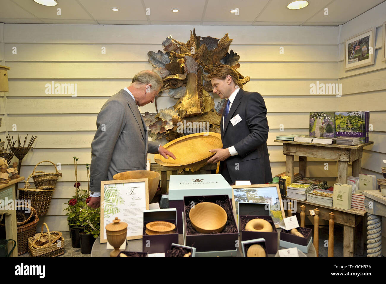 The Prince of Wales is shown a wooden bowl made out of the cedar wood ...