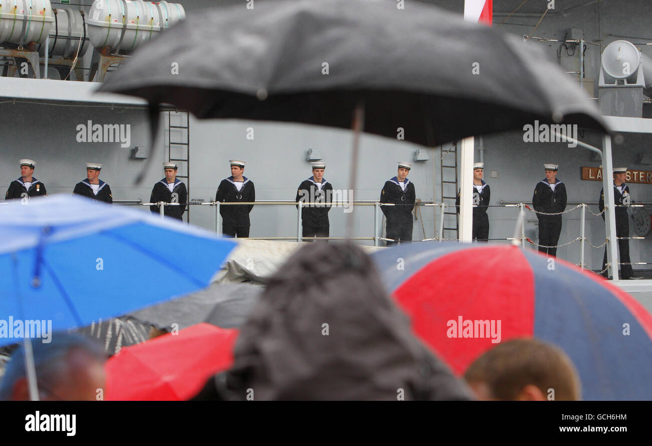 The ship's company line the decks of HMS Lancaster as they are welcomed ...