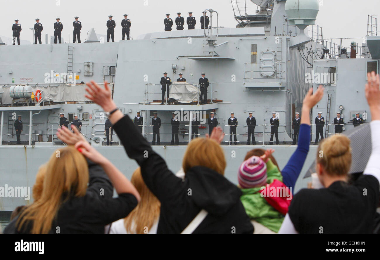 The ship's company line the decks of HMS Lancaster as they are welcomed ...