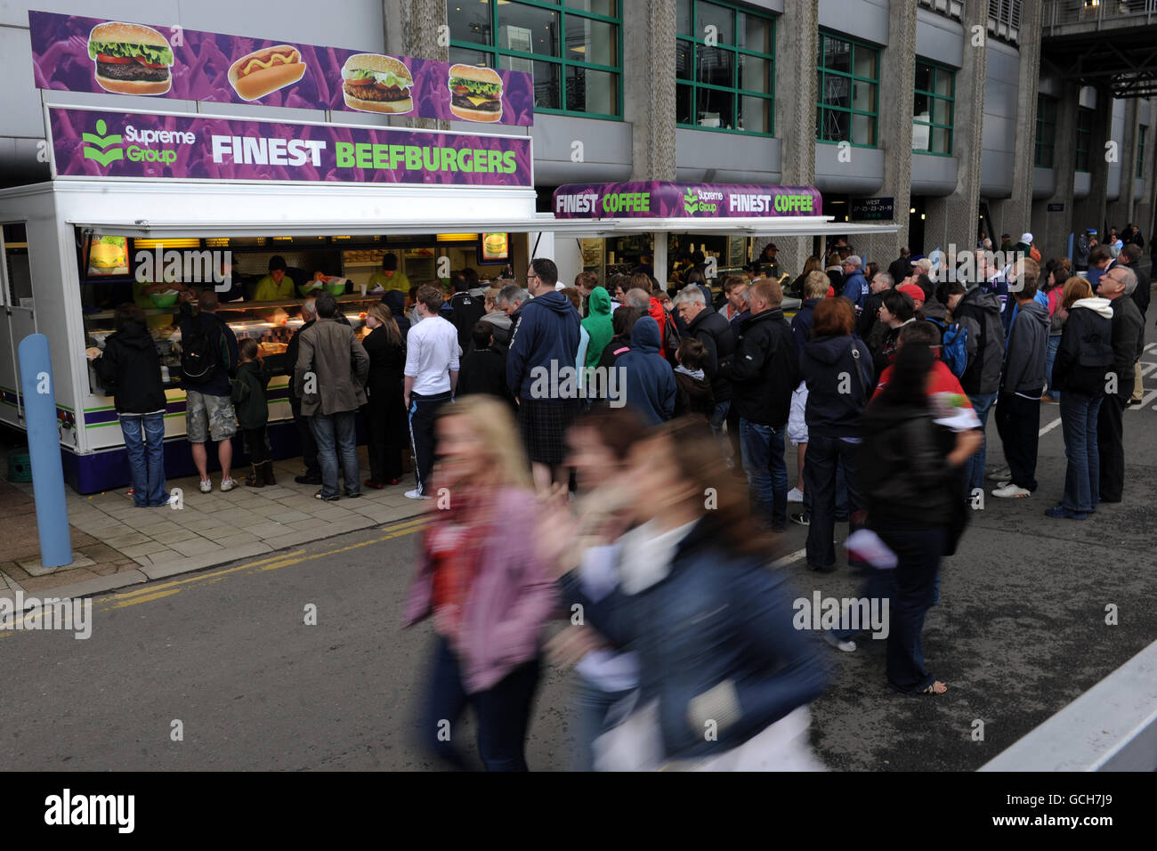 Fans queue up to buy food from one of the catering vans at Murrayfield ...